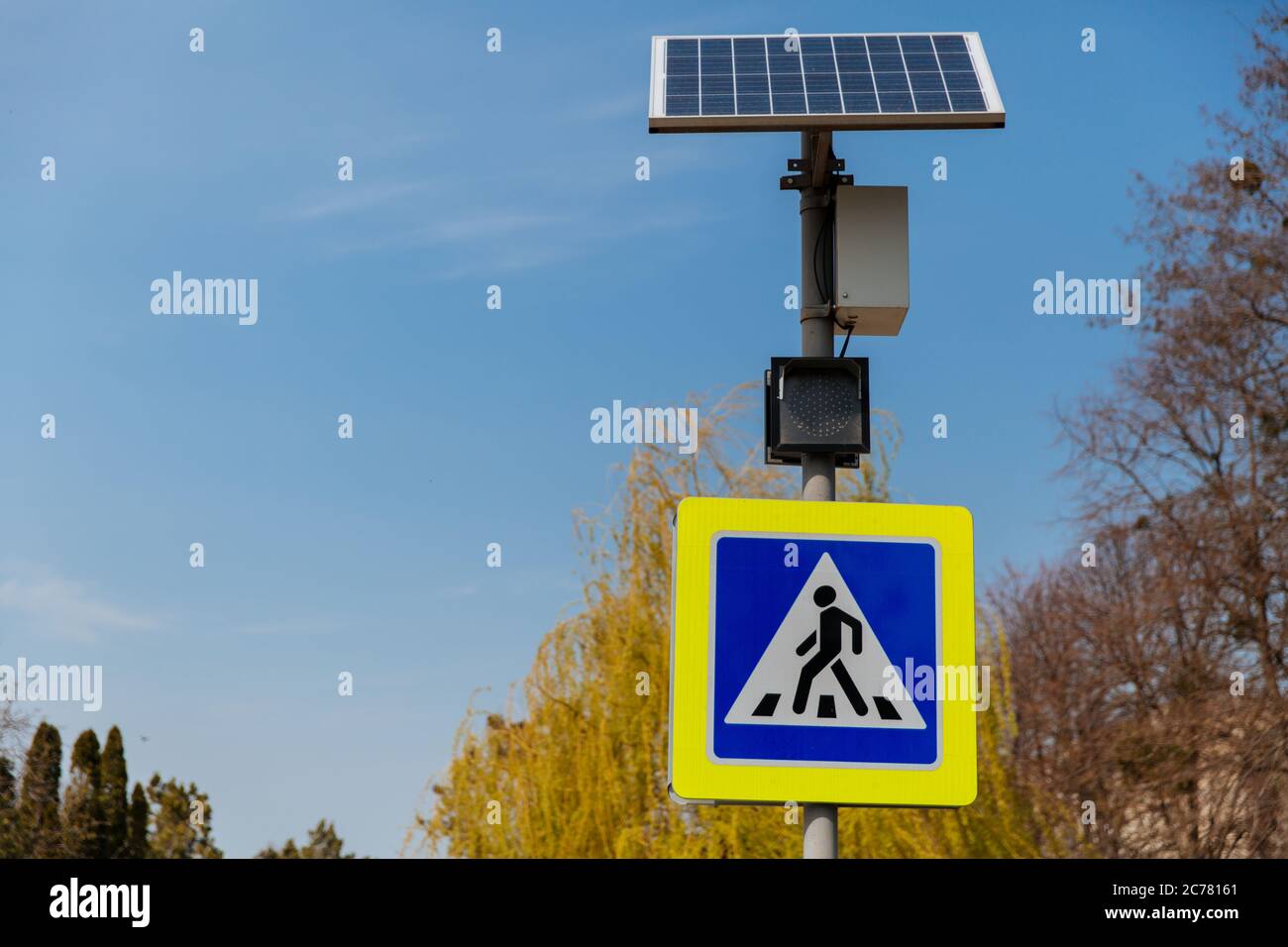 The pedestrian crossing sign powered by solar panels installed above ...