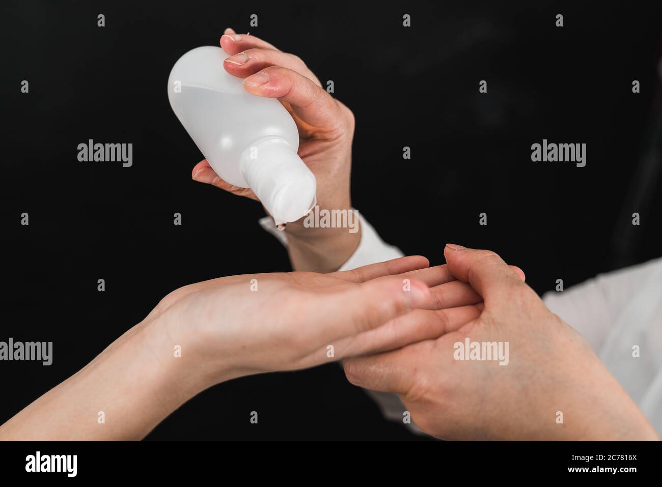 Pouring gel to clean hands with sanitizer antiseptic gel hi-res stock ...