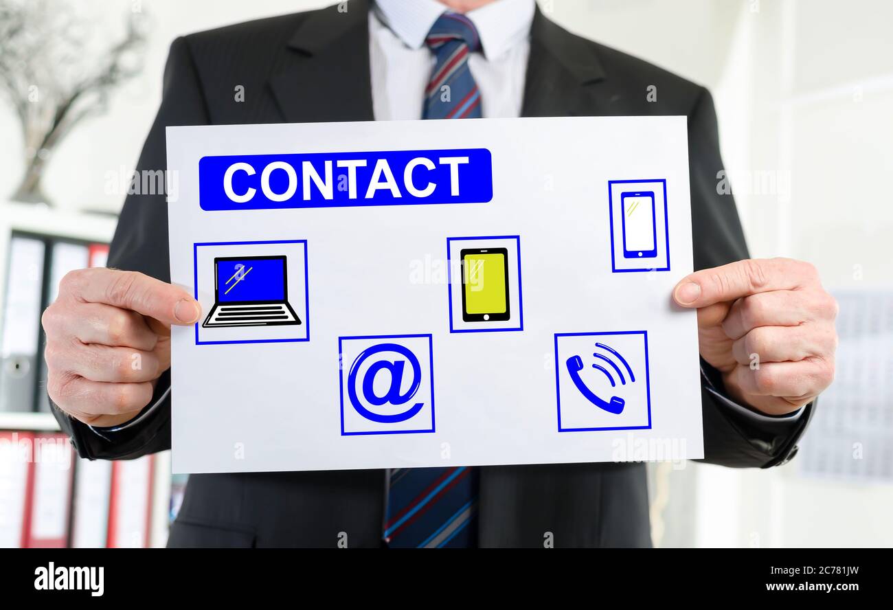 Paper showing contact concept held by a businessman Stock Photo - Alamy
