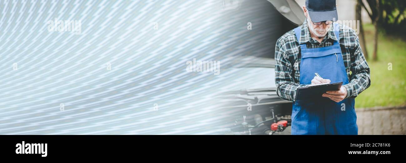 Car mechanic checking a car engine and writing on clipboard; panoramic ...