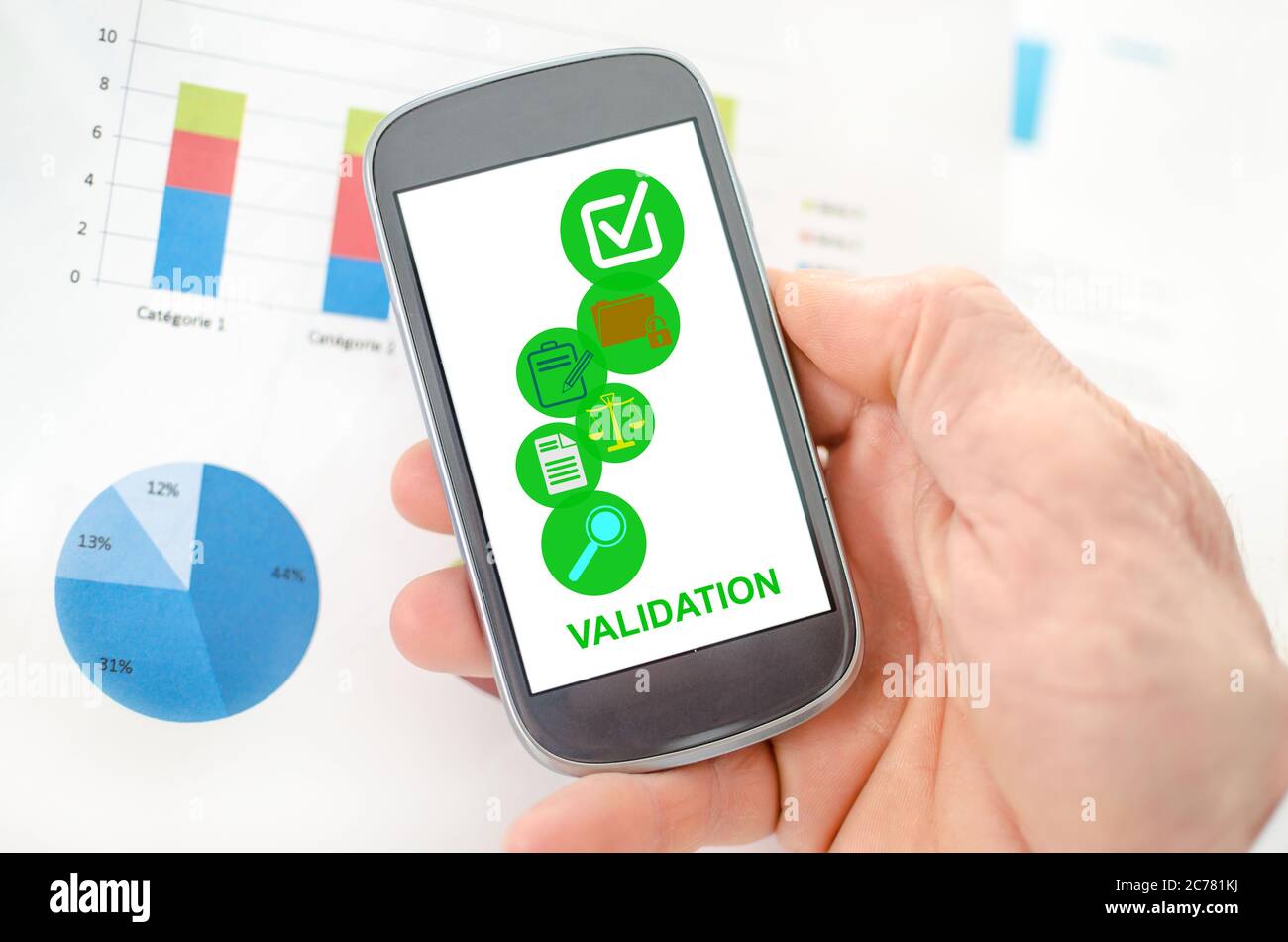 Validation concept on a smartphone held by a hand Stock Photo - Alamy