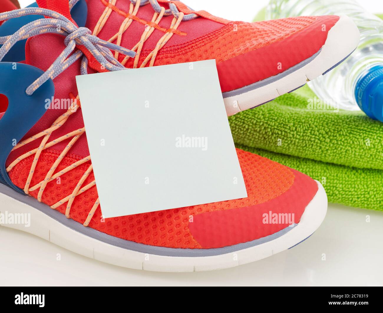 Blank adhesive note and sport equipment Stock Photo - Alamy
