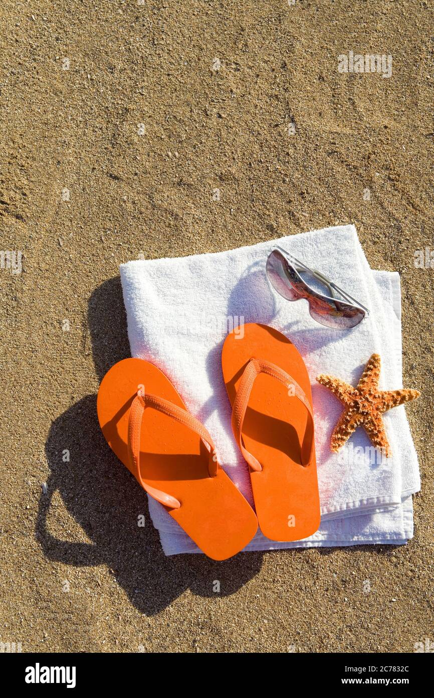 Beach items on sand Stock Photo - Alamy