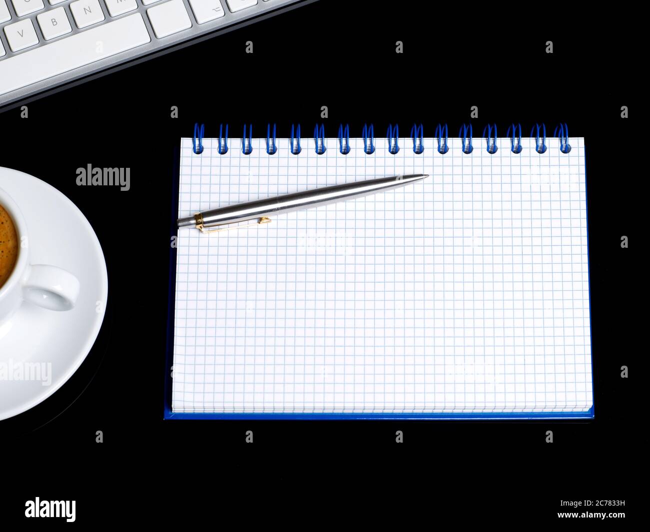 Blank notebook on desk Stock Photo - Alamy