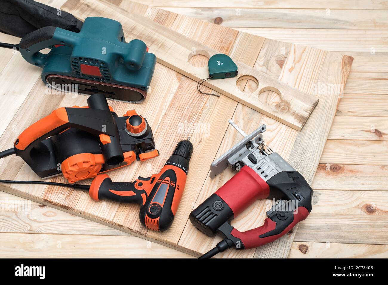 Set of handheld woodworking power tools for woodworking and workpiece ...