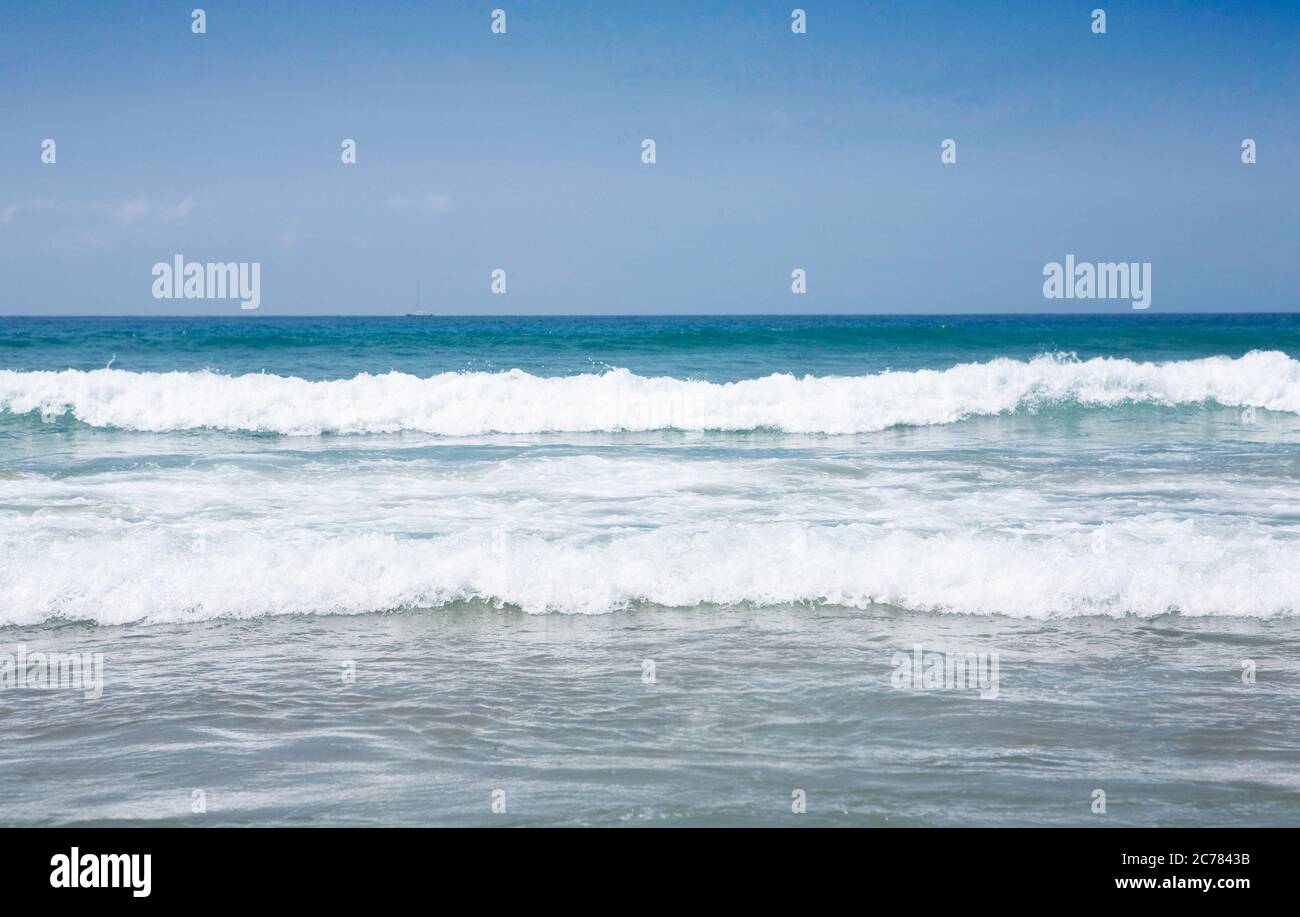 Waves splashing on the beach Stock Photo - Alamy