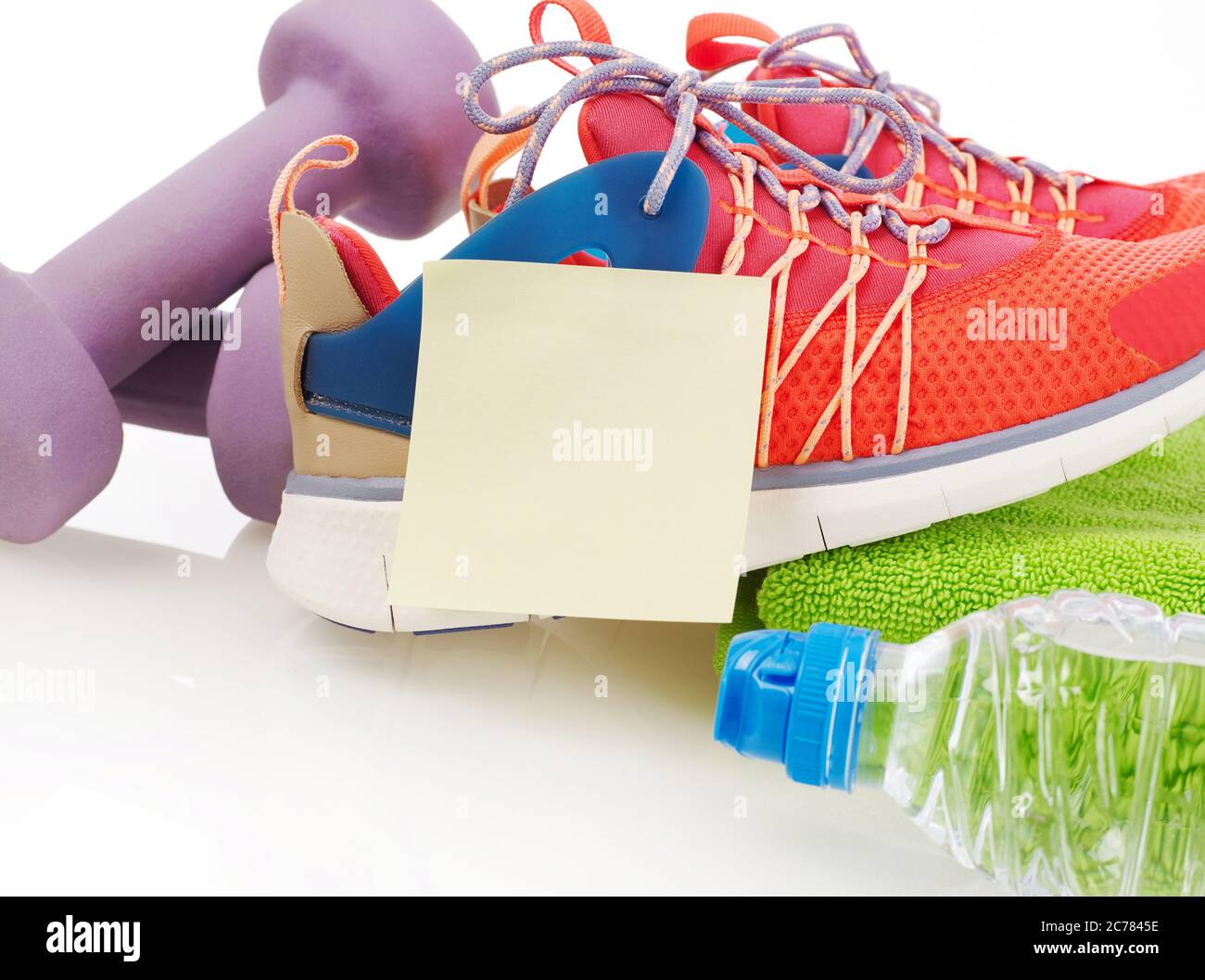 Blank adhesive note and sport equipment Stock Photo - Alamy