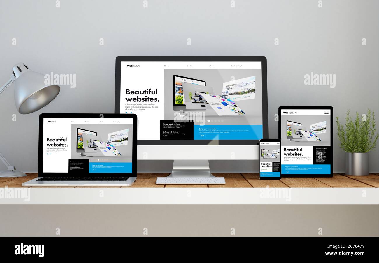 A computer, laptop, smartphone and tablet on a desktop workspace with ...