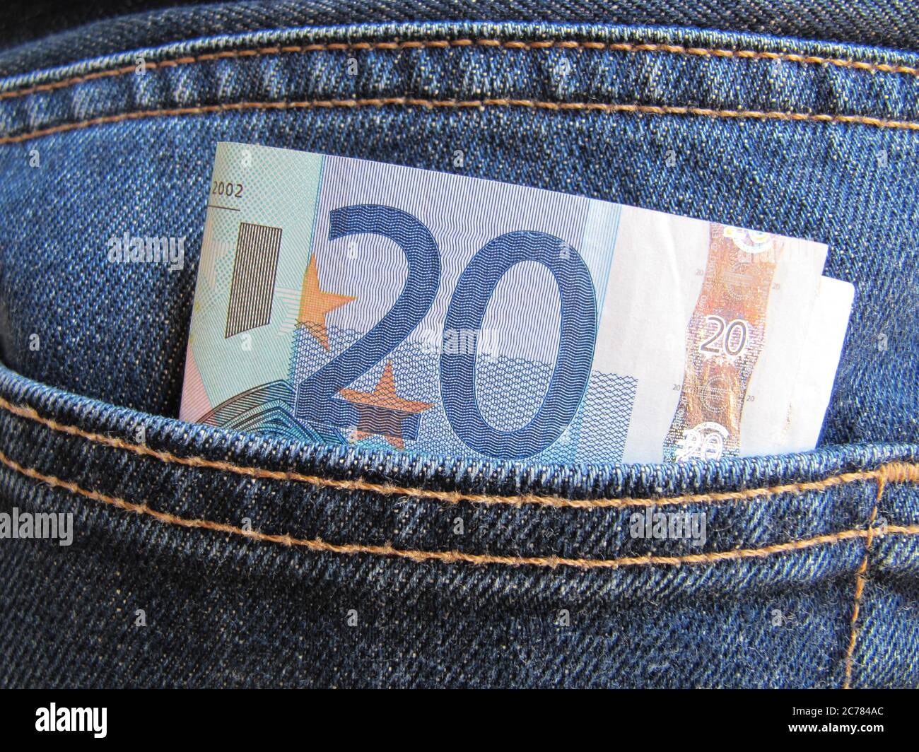 Banknotes in your pocket, euros in jeans Stock Photo - Alamy