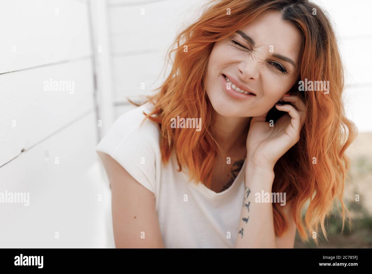 Portrait of a young smiling happy ginger woman outdoor Stock Photo - Alamy