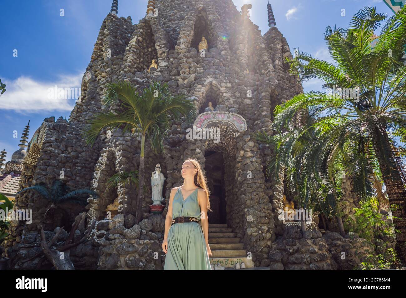 Woman tourist in Chua Tu Van temple made of shells and corals or the ...