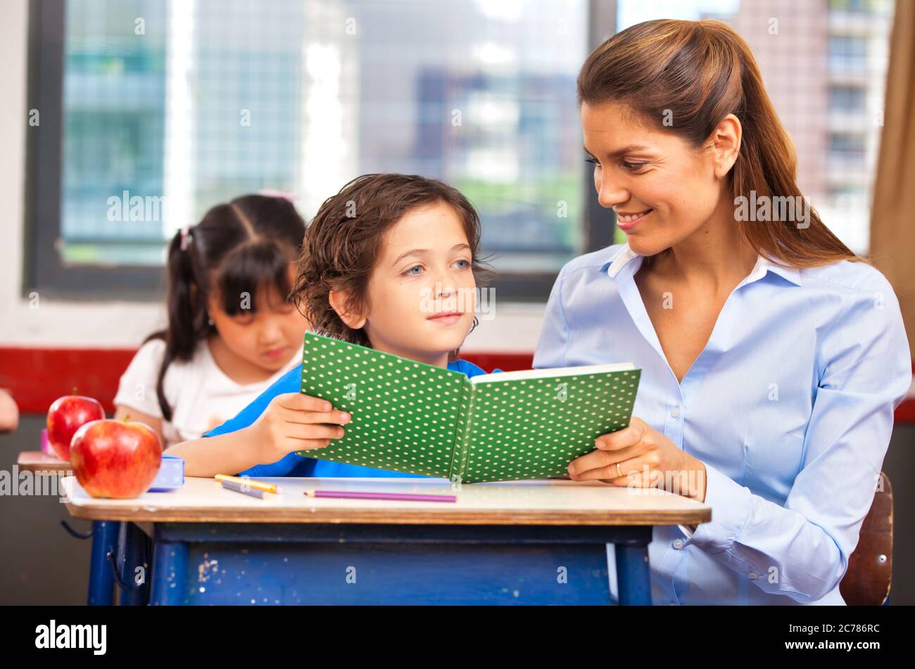 Elementary school scene. Multi ethnic classmates in the classroom Stock ...