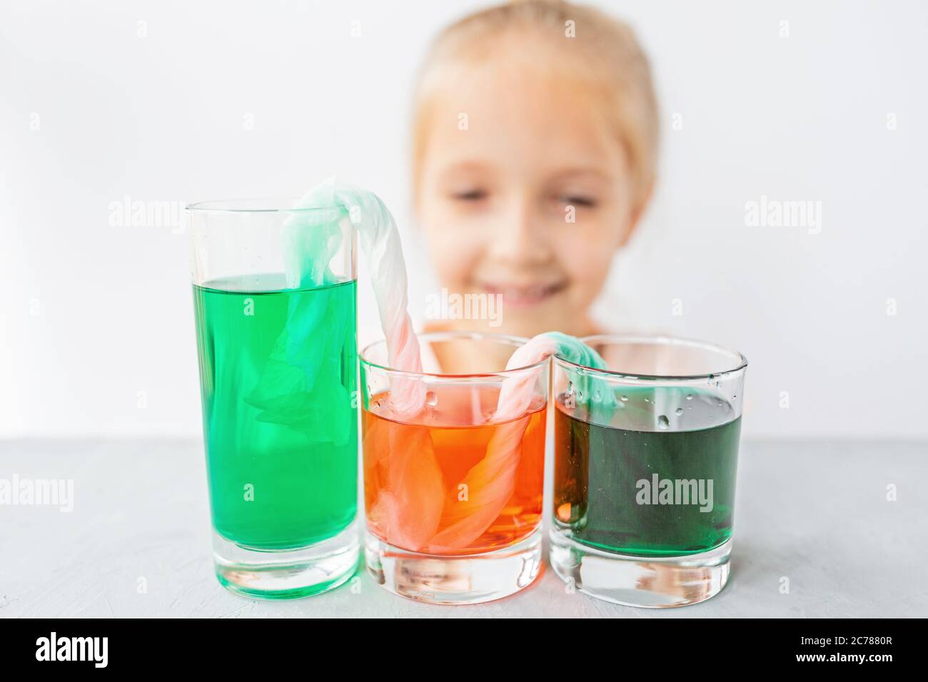 cute little girl six years old doing laboratory experiment with ...