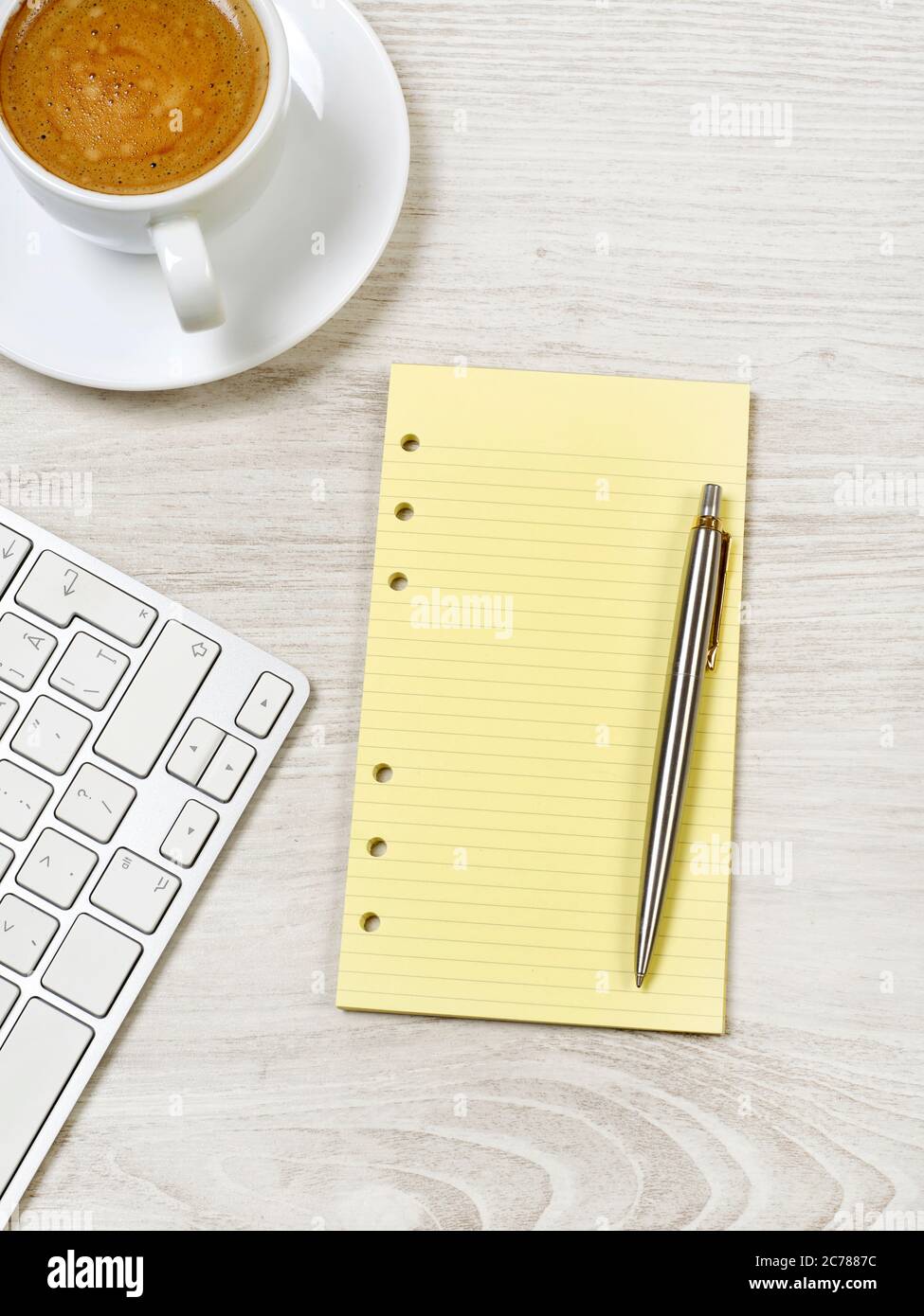 Blank notepad, keyboard and coffee Stock Photo - Alamy