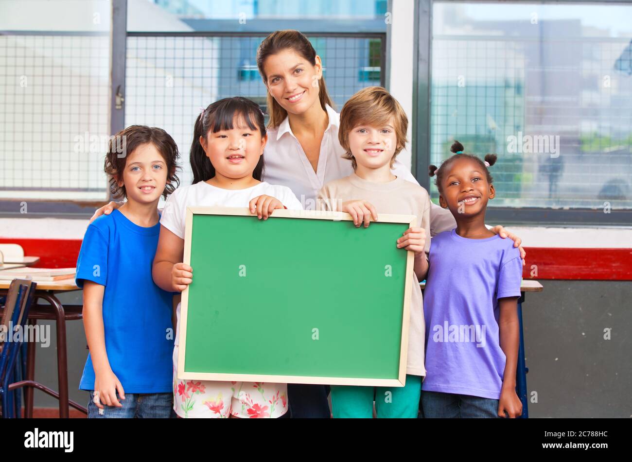 Classroom holding an empty chalkboard. Back to school concept Stock ...