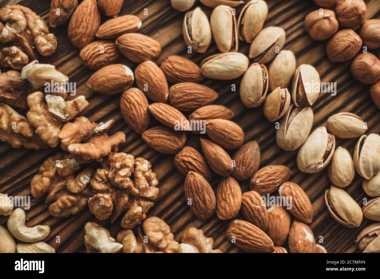 Different types of nuts, nut mix of almonds, hazelnuts, cashews ...