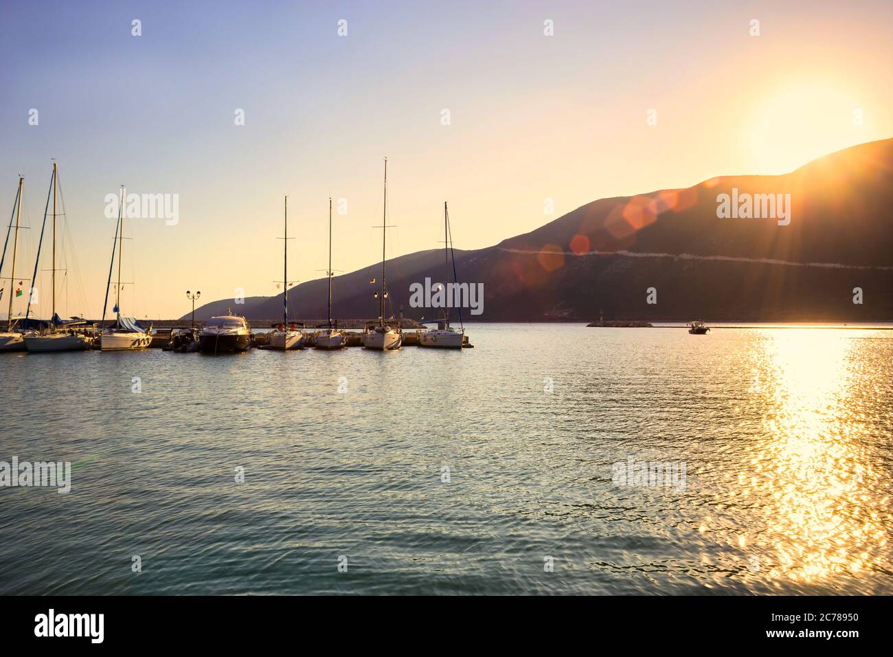 Beautiful sunset in the port of Vasiliki vilage, Lefkada island, Greece ...