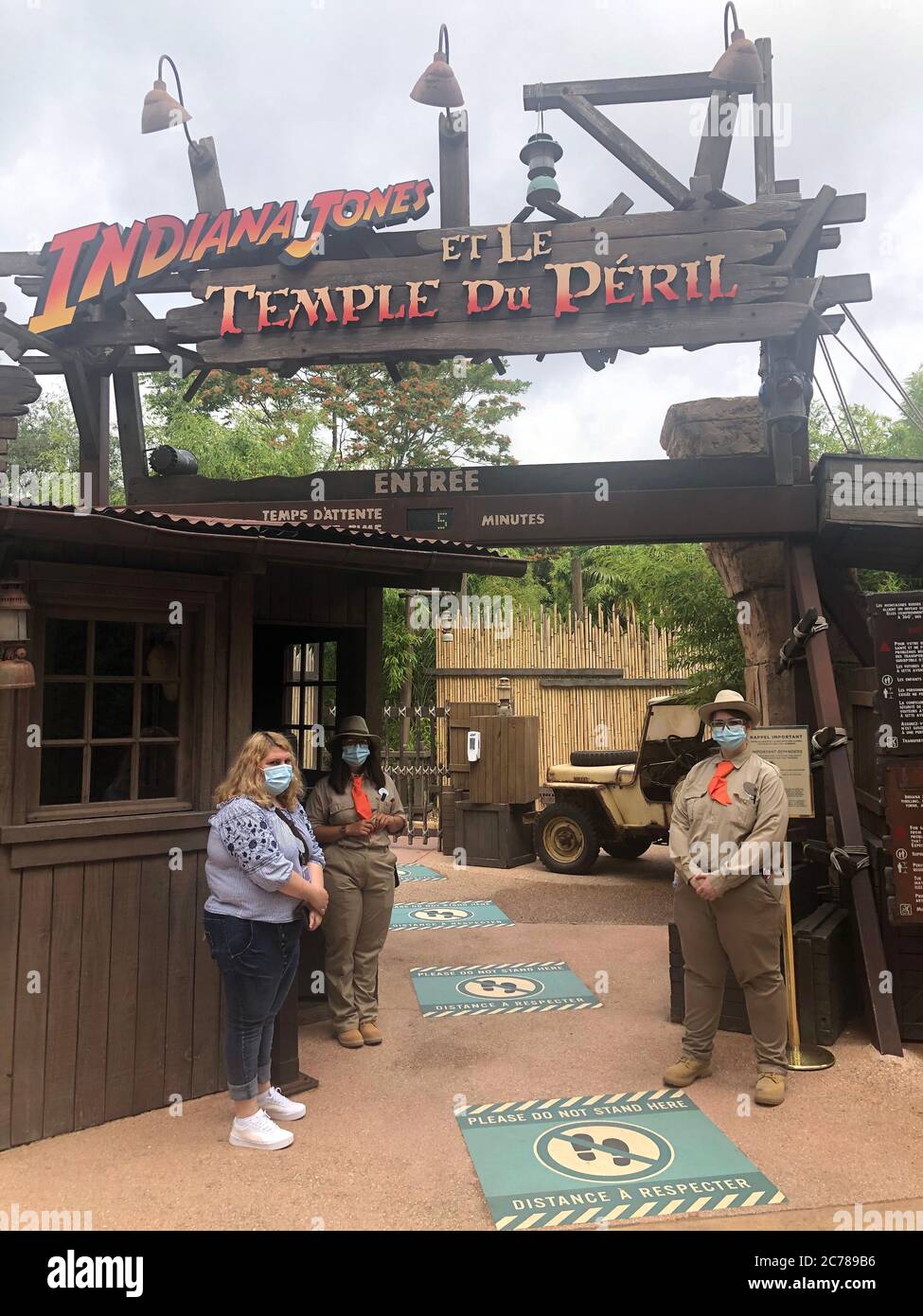 Guests wait in a queue for the Indiana Jones ride, as Disneyland Paris ...