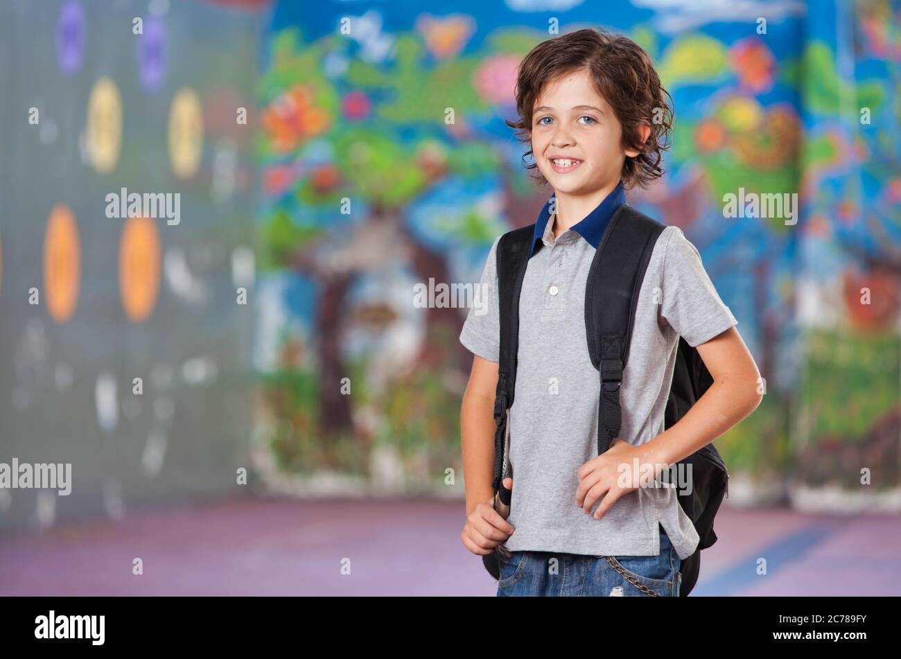 Boy with backpack happy at primary school. Back to school concept Stock ...