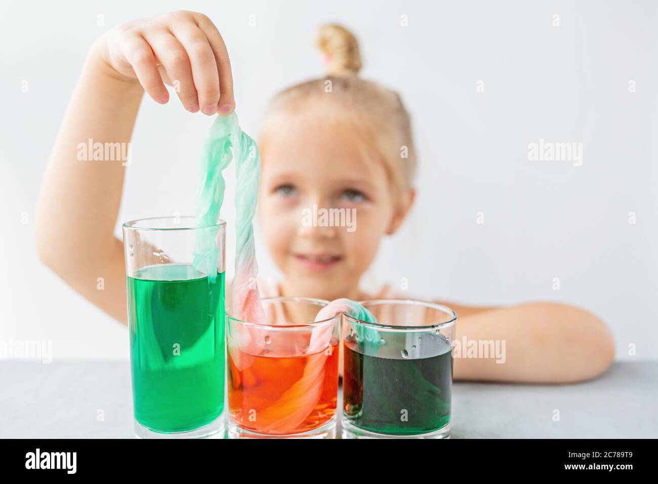 cute little girl six years old doing laboratory experiment with ...