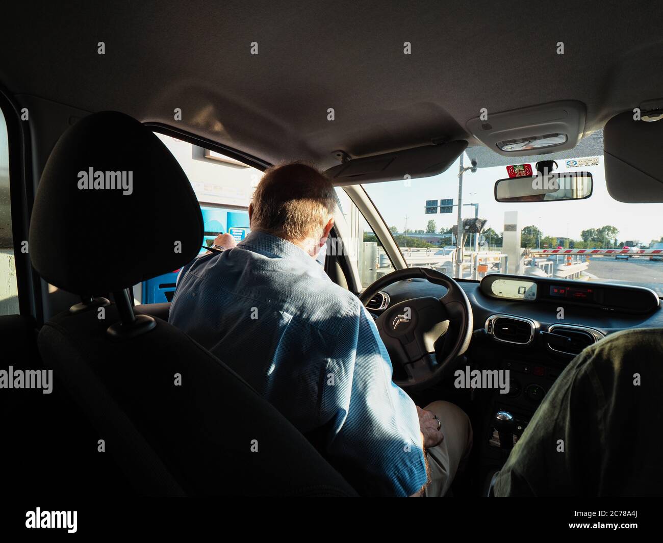 Adult caucasian man driving in italy , view from inside the car Stock ...