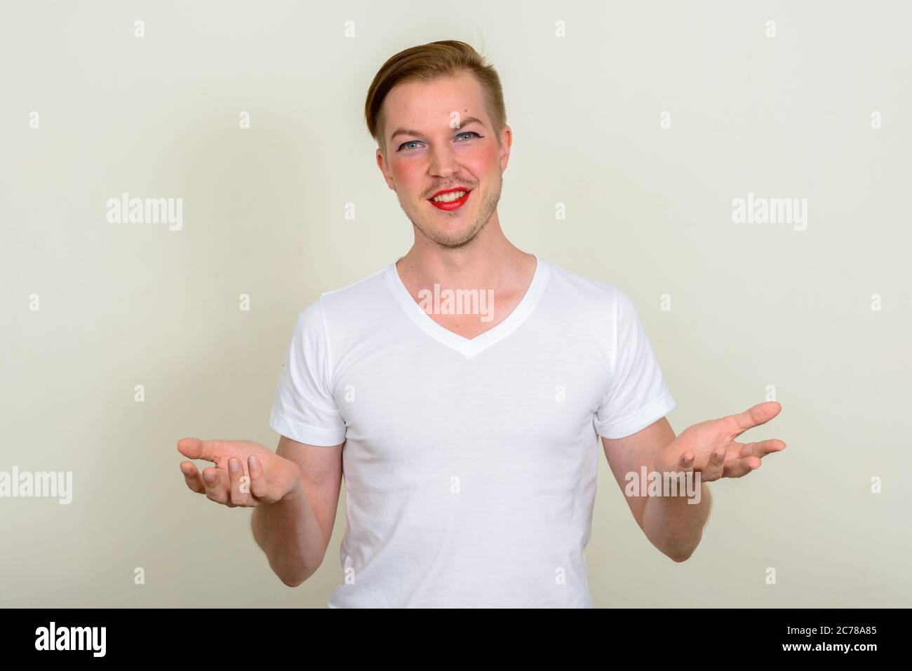 Portrait of young man with beard stubble wearing makeup Stock Photo - Alamy