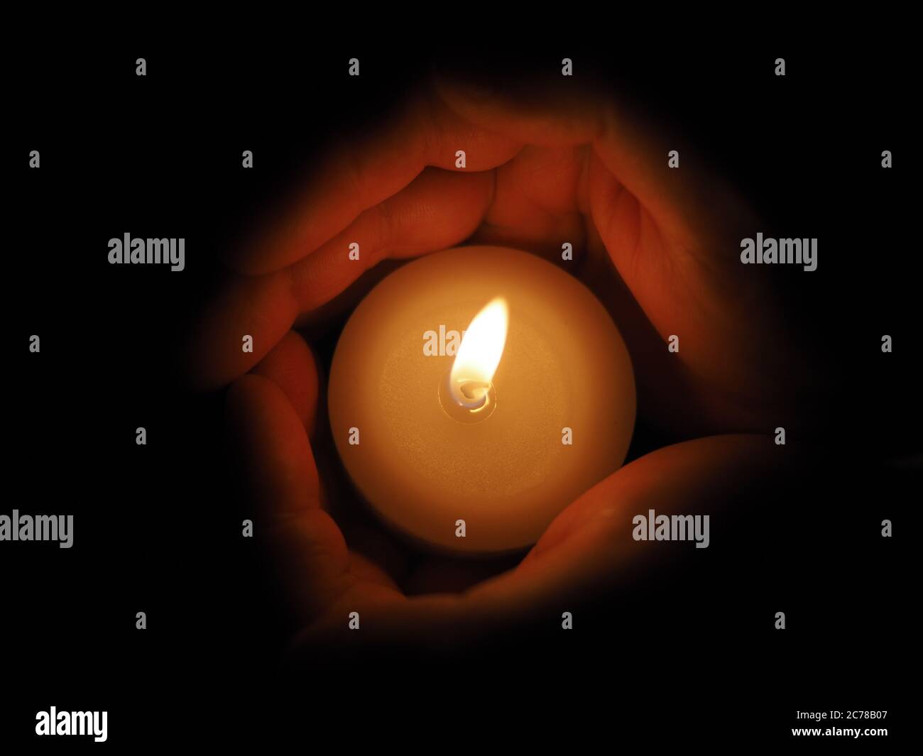Hand holding candle cosy hi-res stock photography and images - Alamy