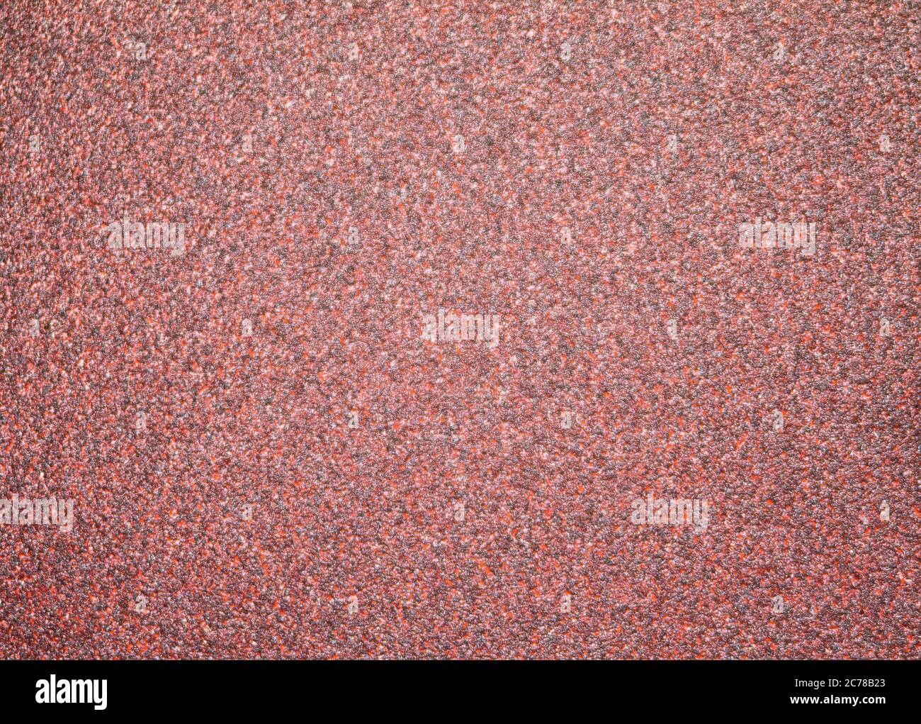 Coarse emery paper texture. In a red purple version Stock Photo - Alamy