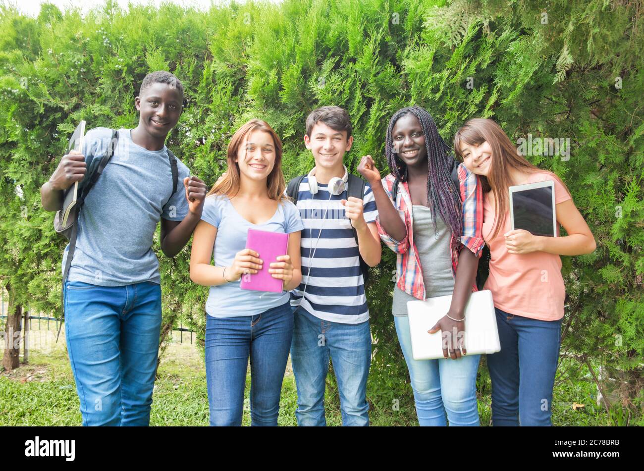 Happy group of multi ethnic teenagers outdoor together Stock Photo - Alamy Happy group of multi ethnic teenagers outdoor together Stock Photo - Alamy