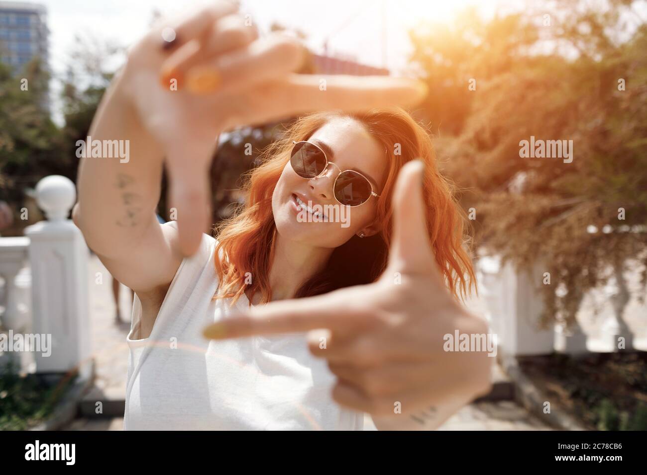 Pretty girl making frame hands hi-res stock photography and images - Alamy