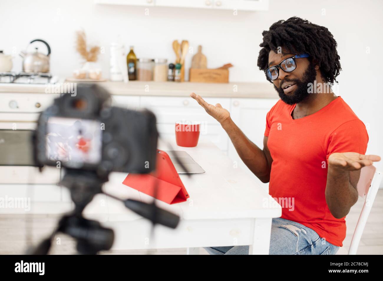 Handsome man recording video business course at home Stock Photo - Alamy