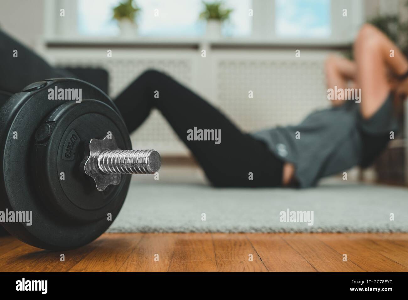 Woman doing crunch exercise. Home fitness training concept Stock Photo ...
