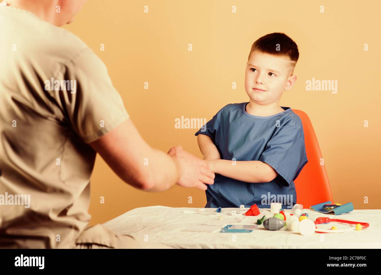 Health care. Pediatrician concept. Boy cute child and his father doctor ...