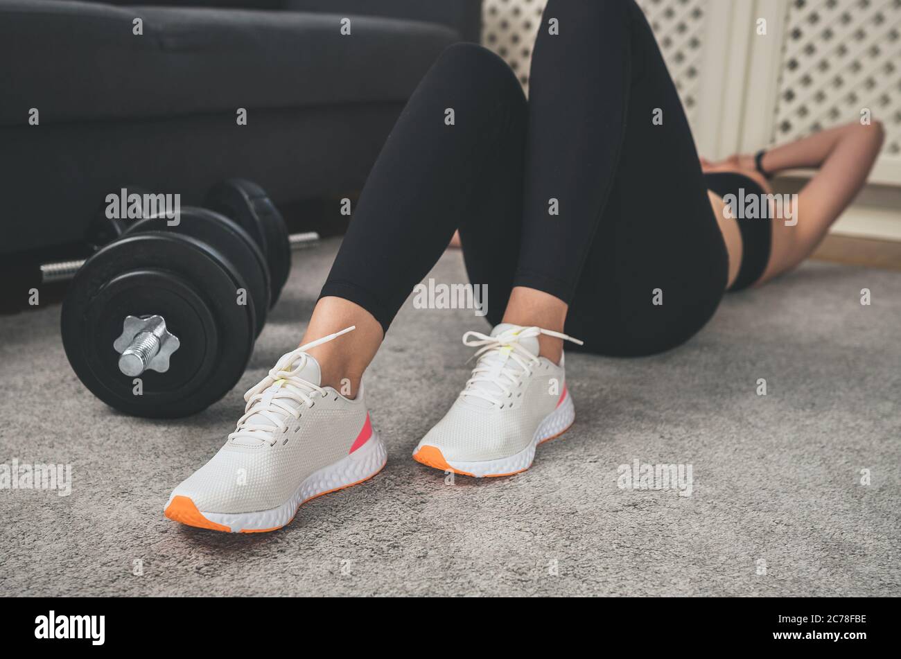 Woman resting between exercise sets. Home fitness training concept ...