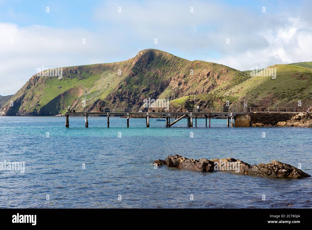 The iconic jetty with rolling green hills in the background on the ...