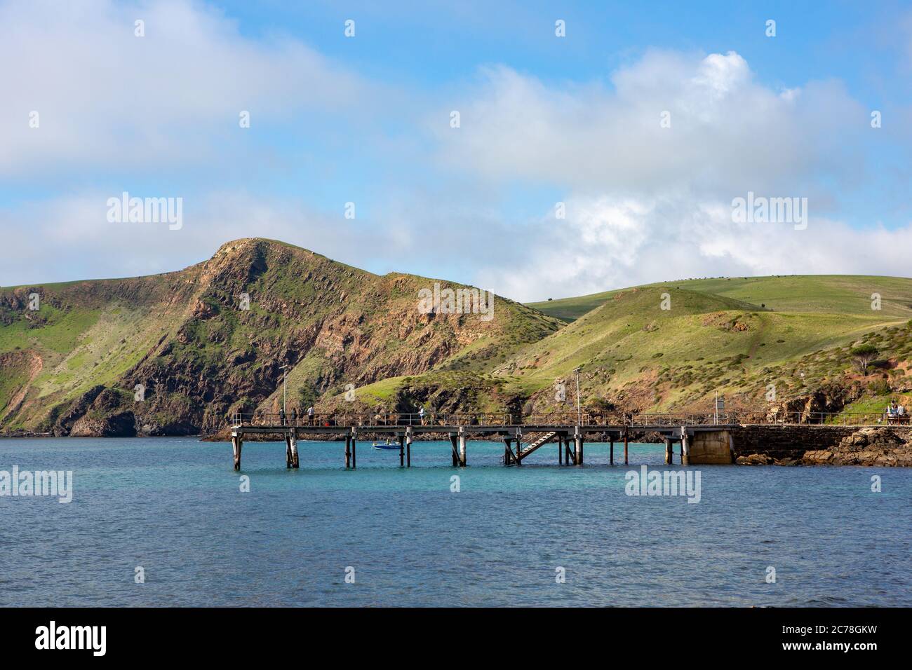 The iconic jetty with rolling green hills in the background on the ...