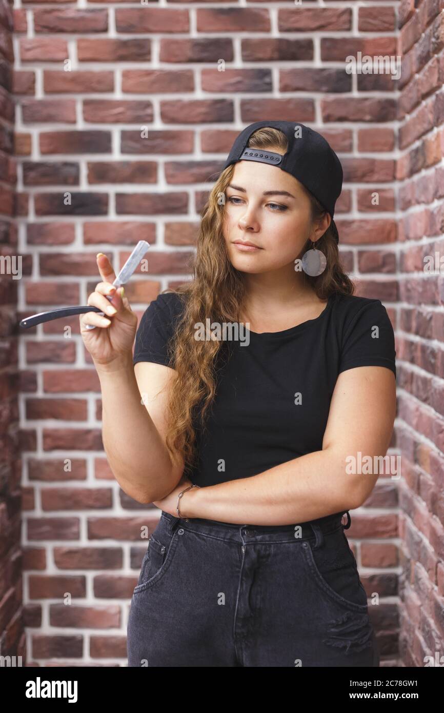 Young woman holding cut razor hi-res stock photography and images - Alamy