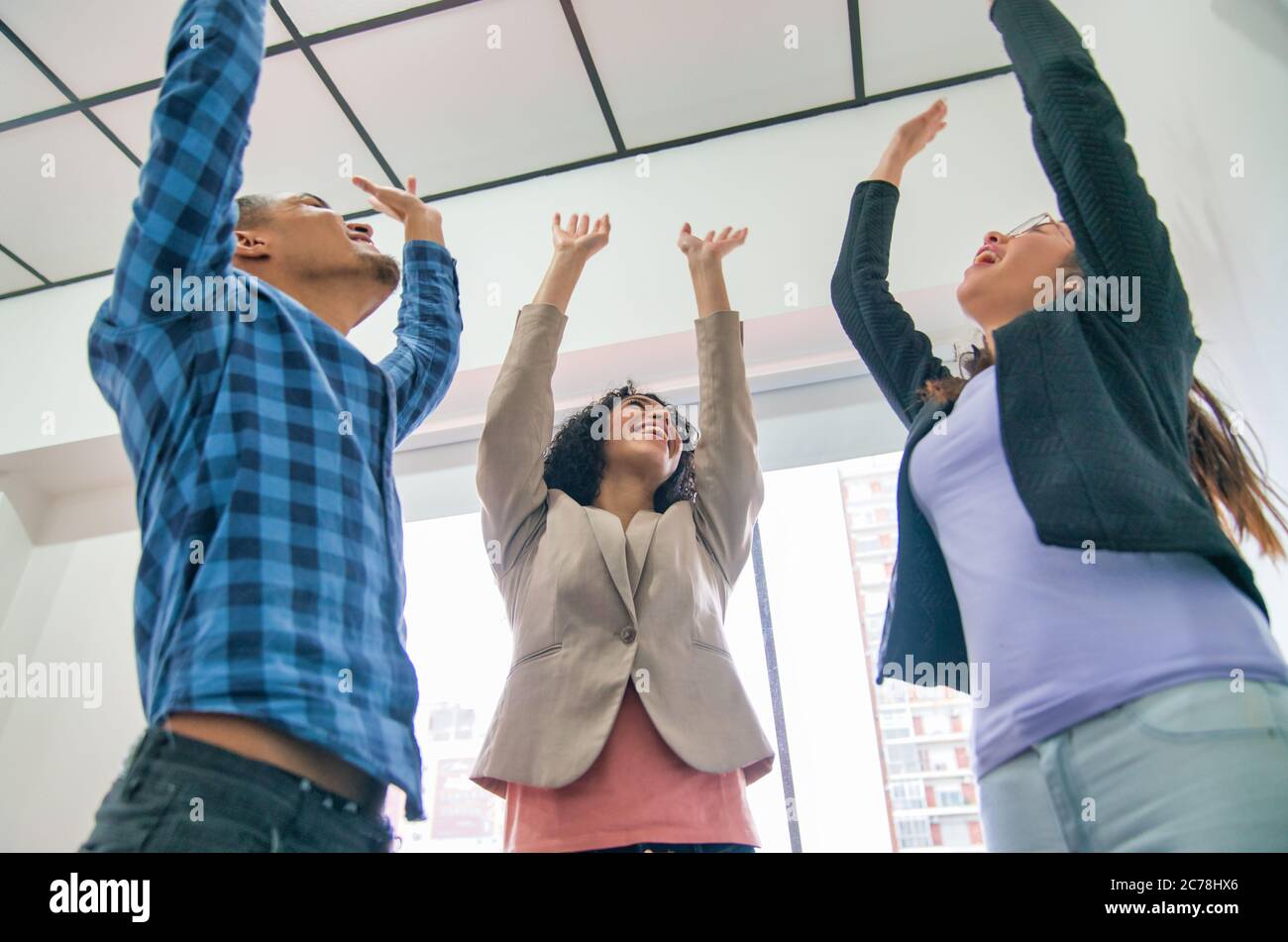 Coworkers cheering hi-res stock photography and images - Alamy