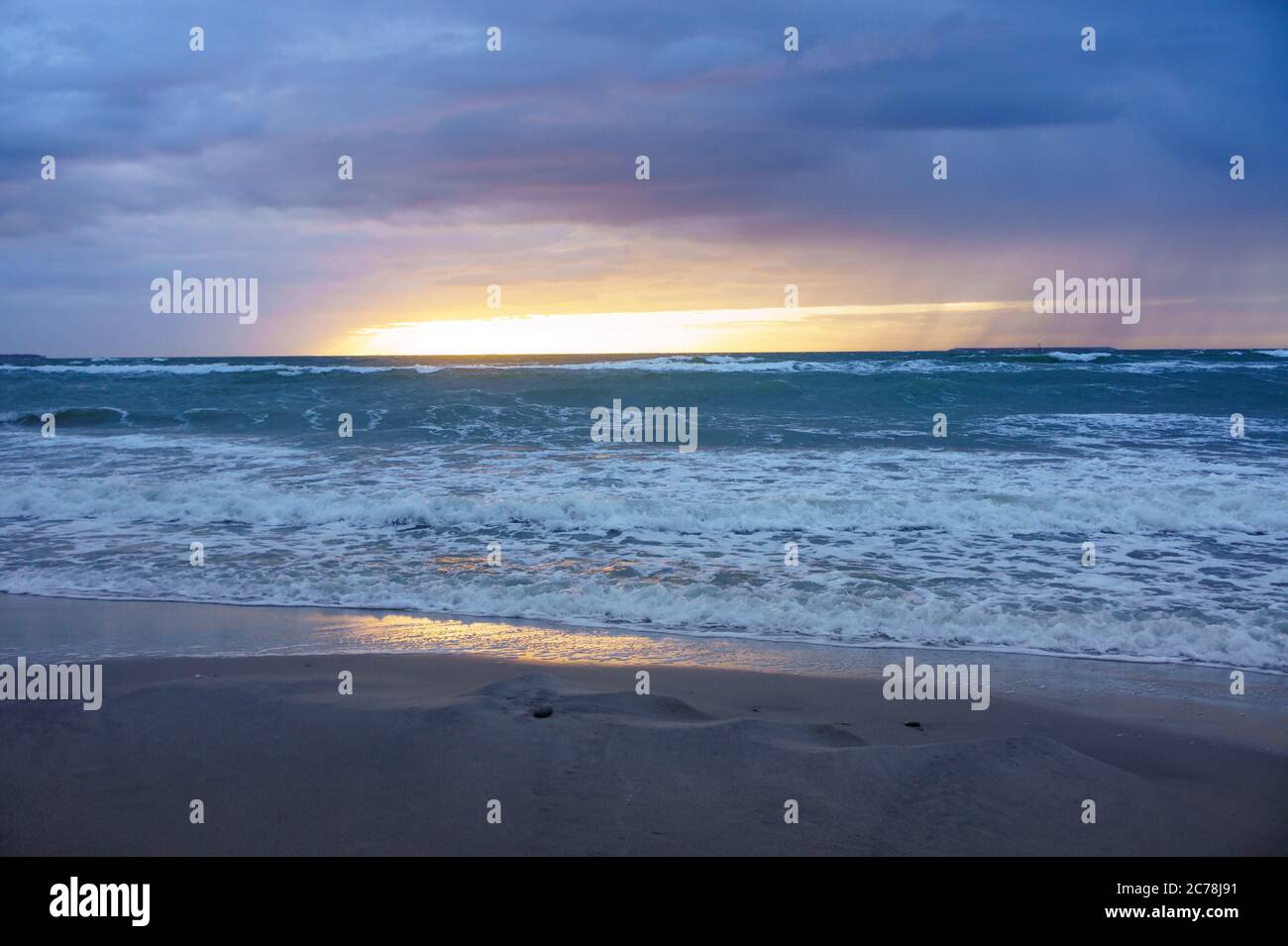 Sunset over the sea. Reflection of sunlight in the sea waves. Red sky ...