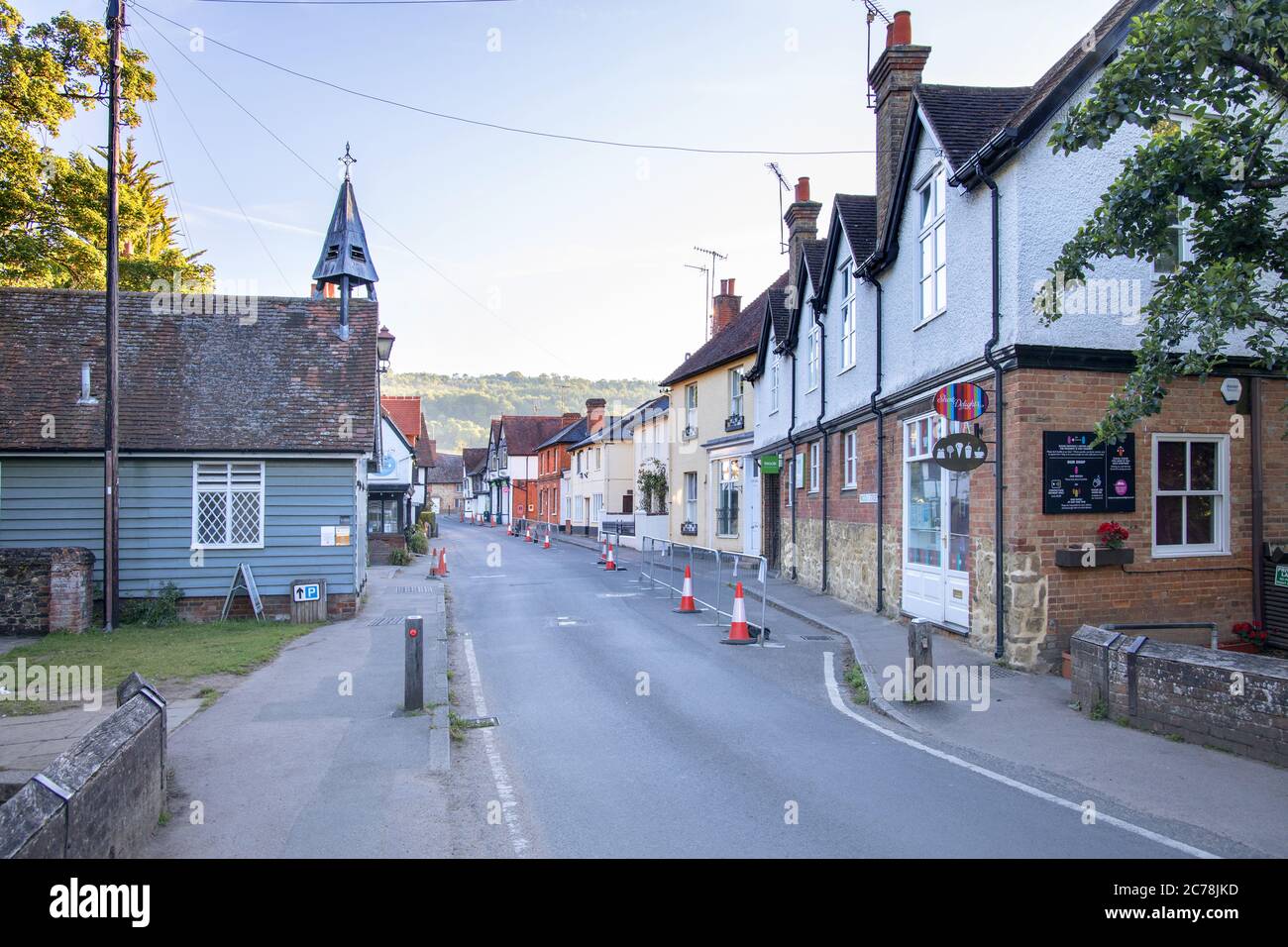 charming old buildings lining the main street in the village of shere ...