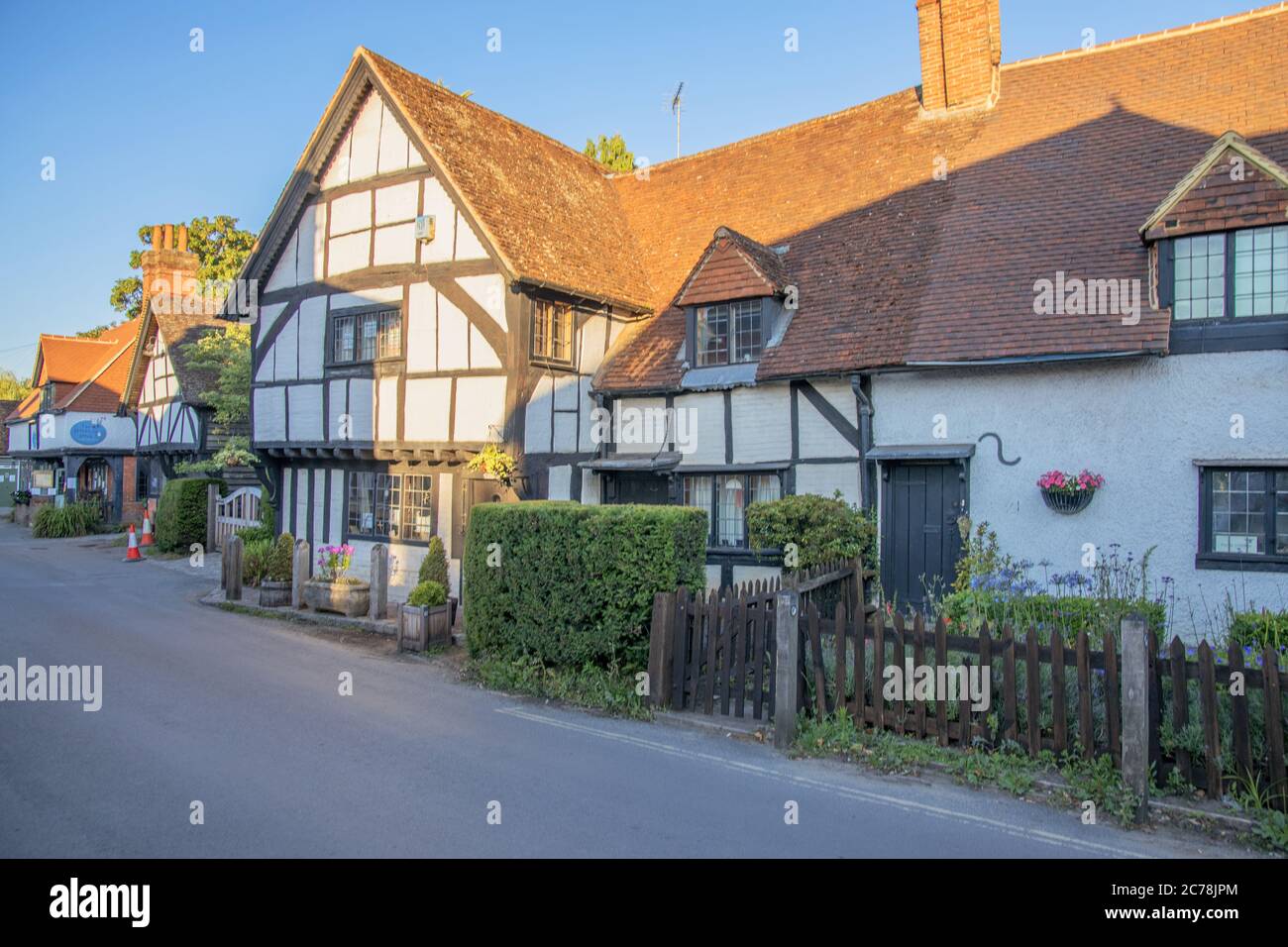 charming old buildings lining the main street in the village of shere ...