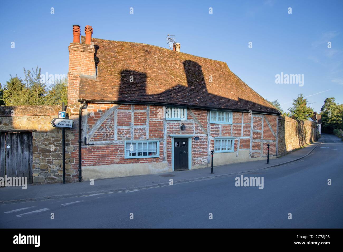 charming old buildings lining the main street in the village of shere ...