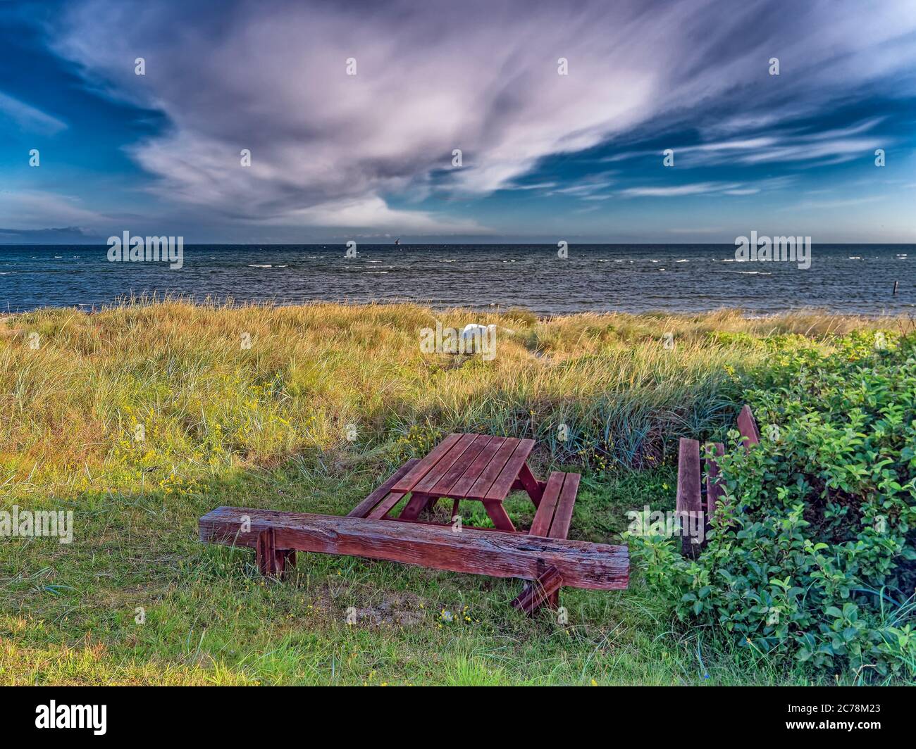 Bench and table on a lonely beach, Denmark Stock Photo - Alamy