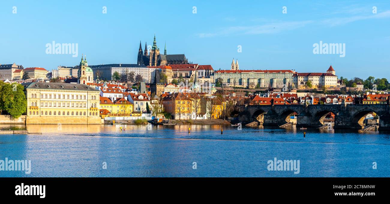 Panoramic view of Prague Castle and Charles Bridge on sunny spring ...