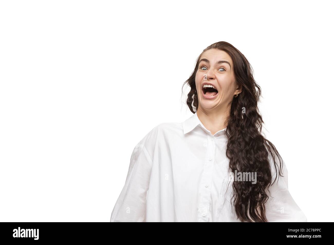 Laughting mad. Young caucasian woman with funny, unusual popular ...