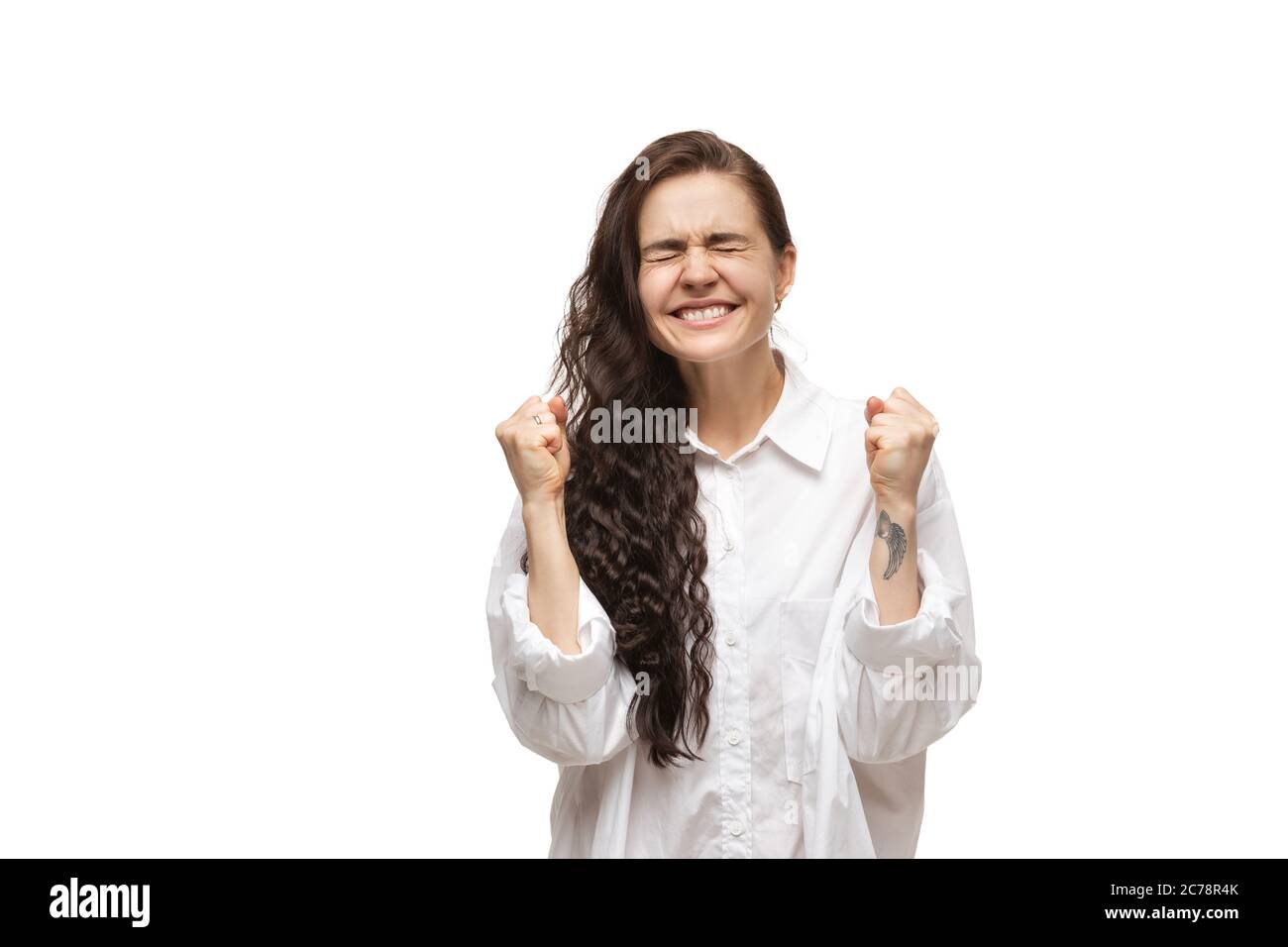 Crazy win. Young caucasian woman with funny, unusual popular emotions ...