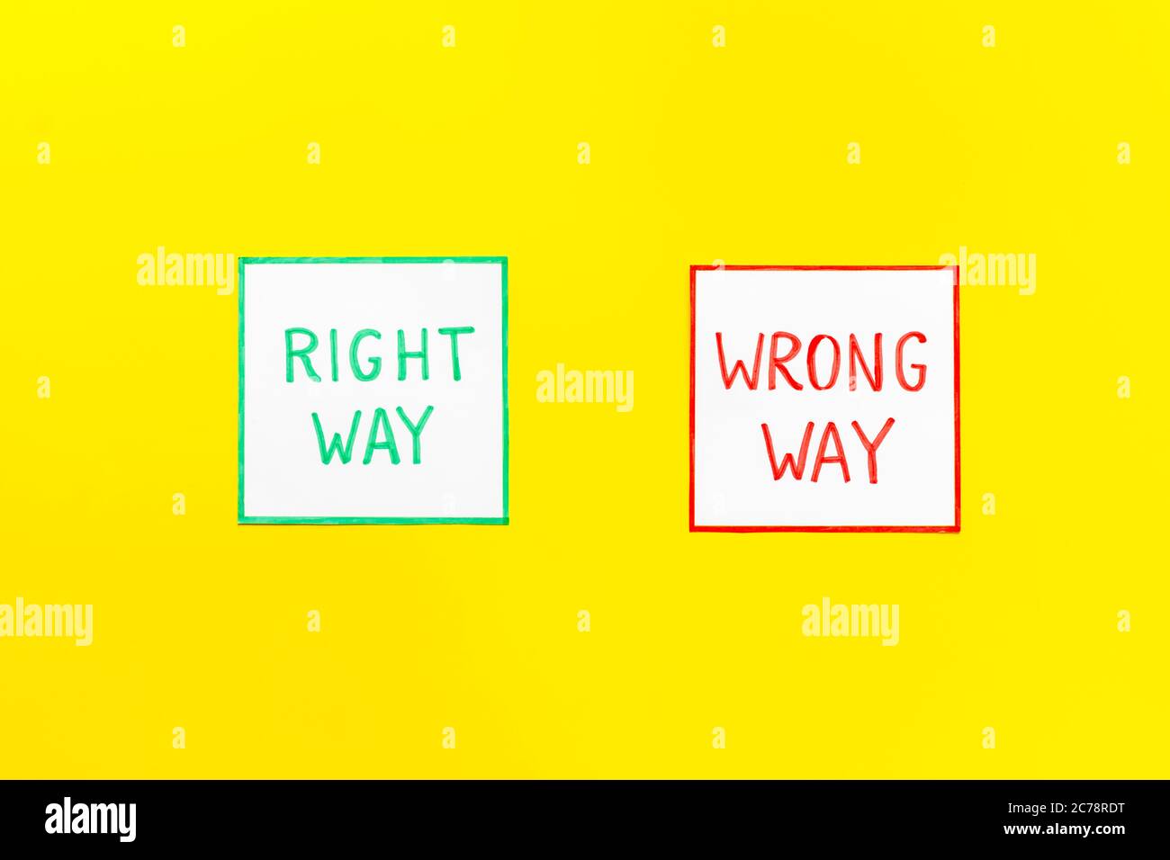 Problem solving. Right and wrong way icons on work desk from above ...