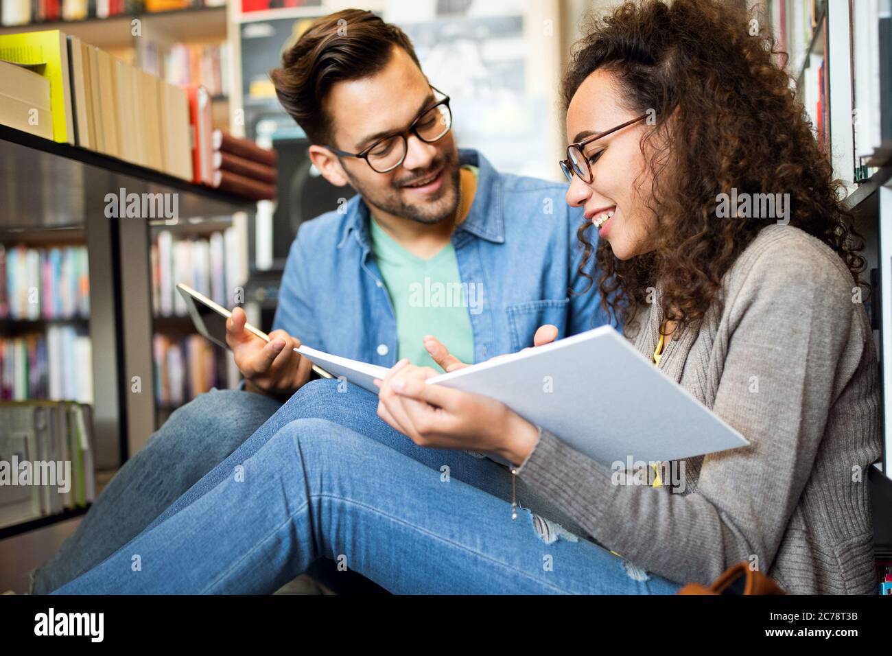 Young interracial couple reading book hi-res stock photography and ...