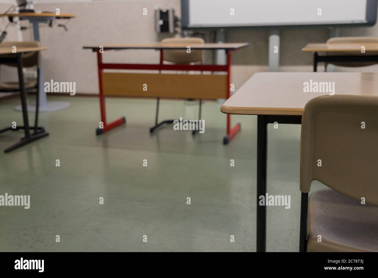 empty classroom with focus on table and chair on right side Stock Photo ...