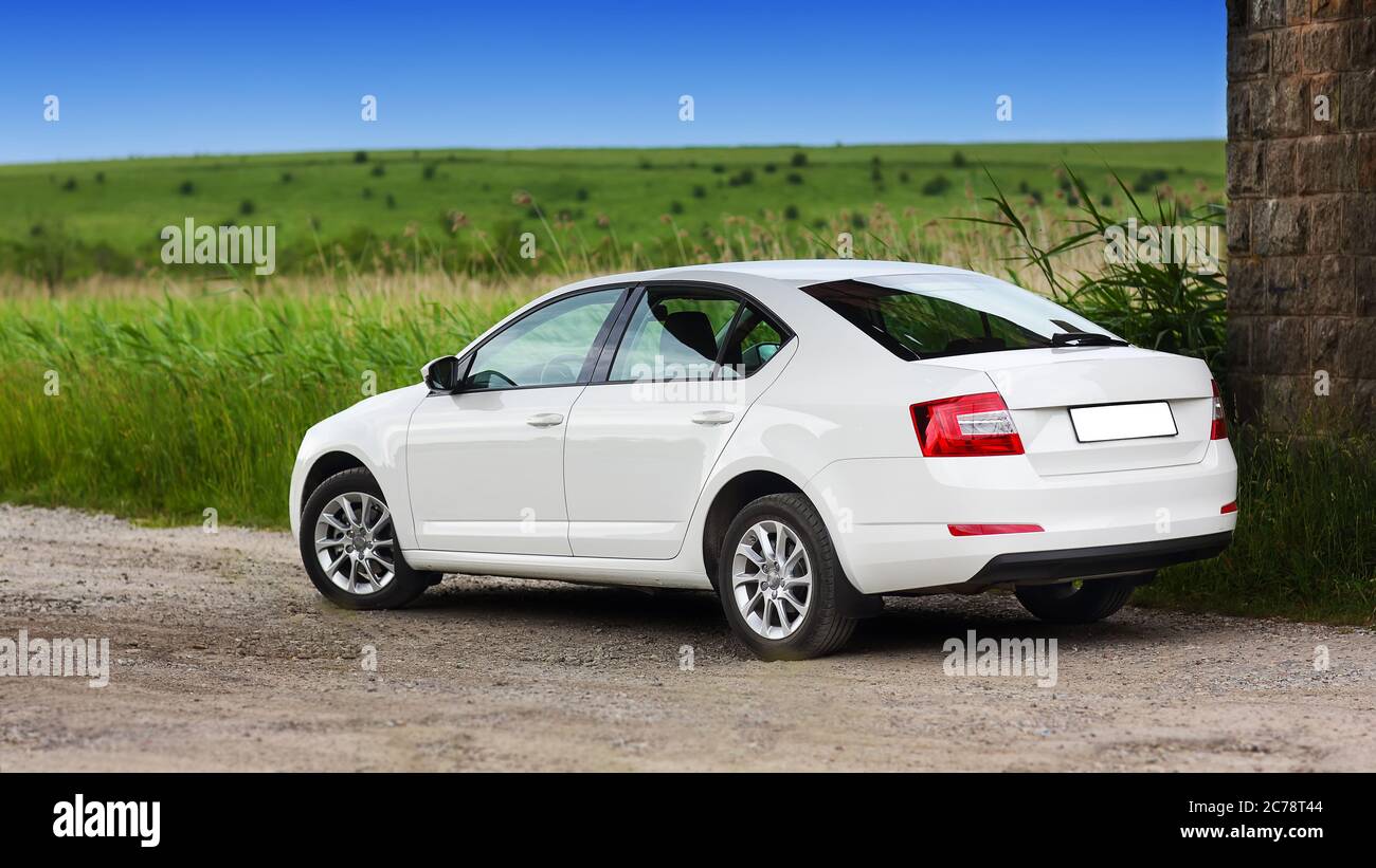Rear-side view of a car on nature background Stock Photo - Alamy